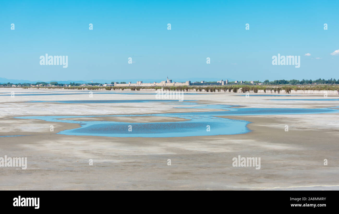 Aigues-Mortes, Salins du Midi, beautiful landscape with the city in ...