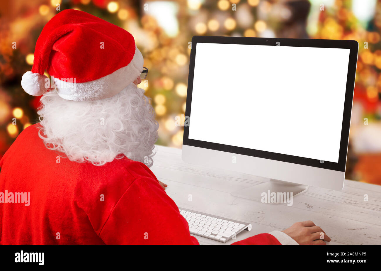 Santa Claus work on computer. Isolated, blank screen for mockup, app or ...