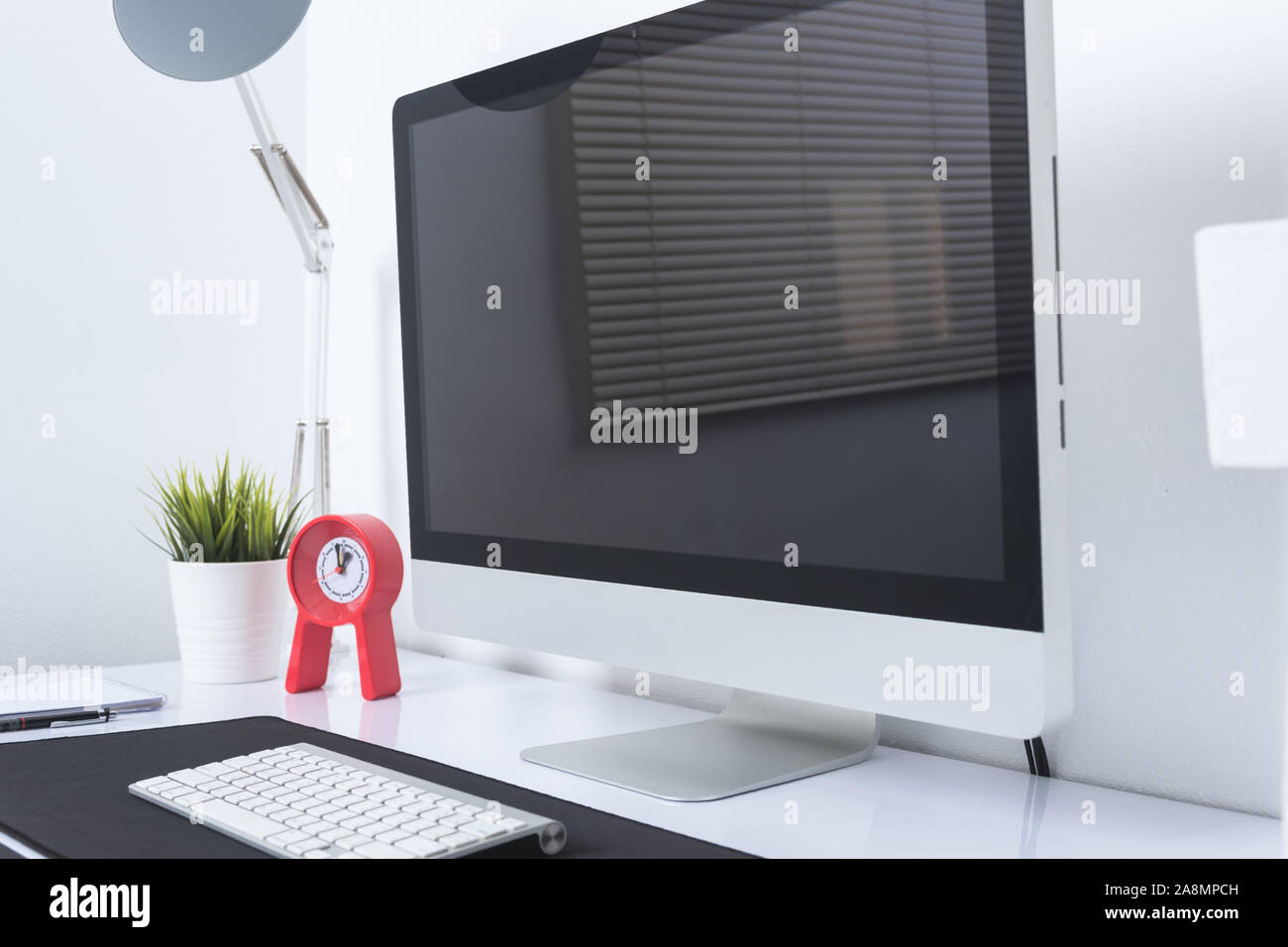 Office computer monitor on desk table workplace blank screen Stock Photo - Alamy