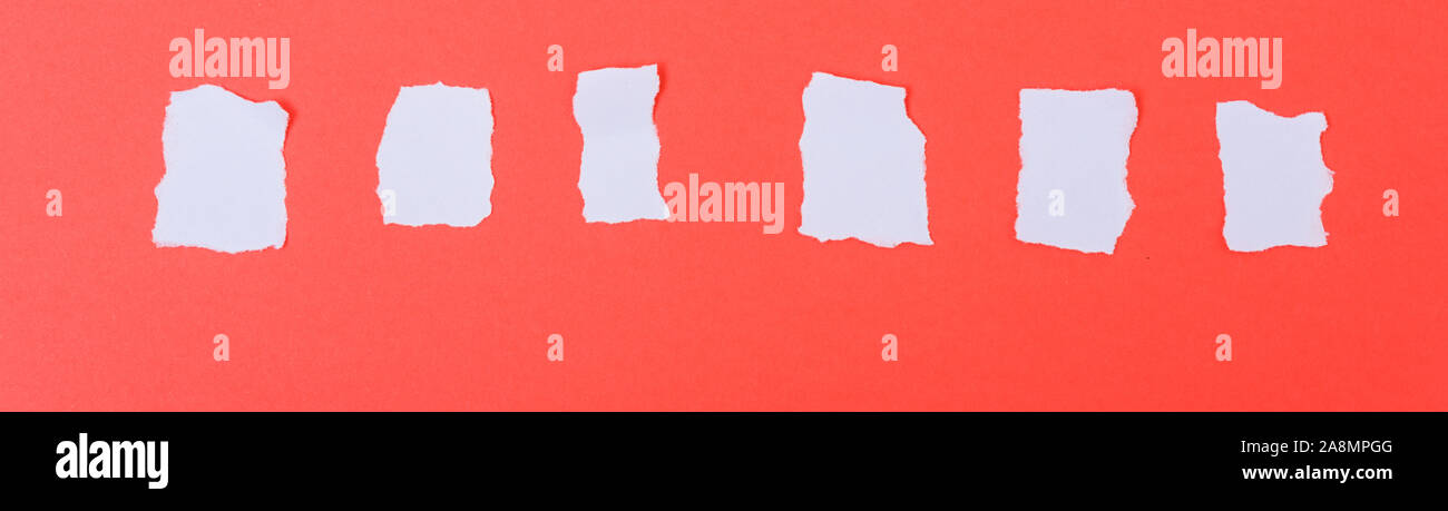 White paper torn into words on a red background Stock Photo - Alamy