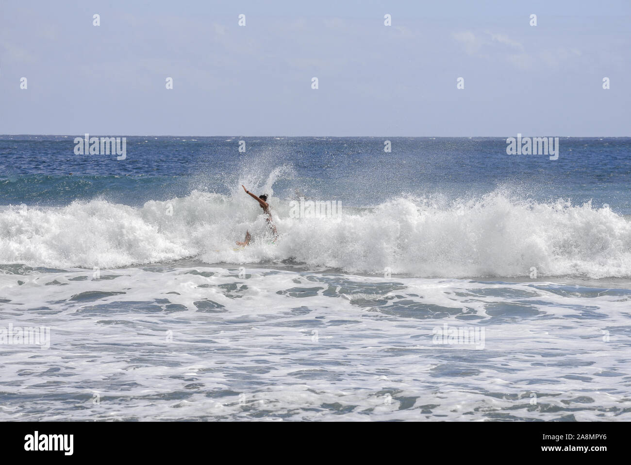 Wave on a beach with black sand, Tahiti, French Polynesia Stock Photo ...
