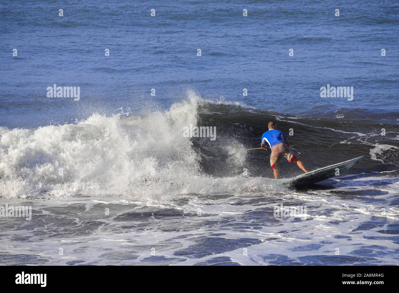 Wave on a beach with black sand, Tahiti, French Polynesia Stock Photo ...