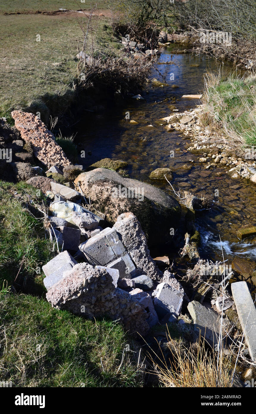Fly tipping in a stream Stock Photo - Alamy