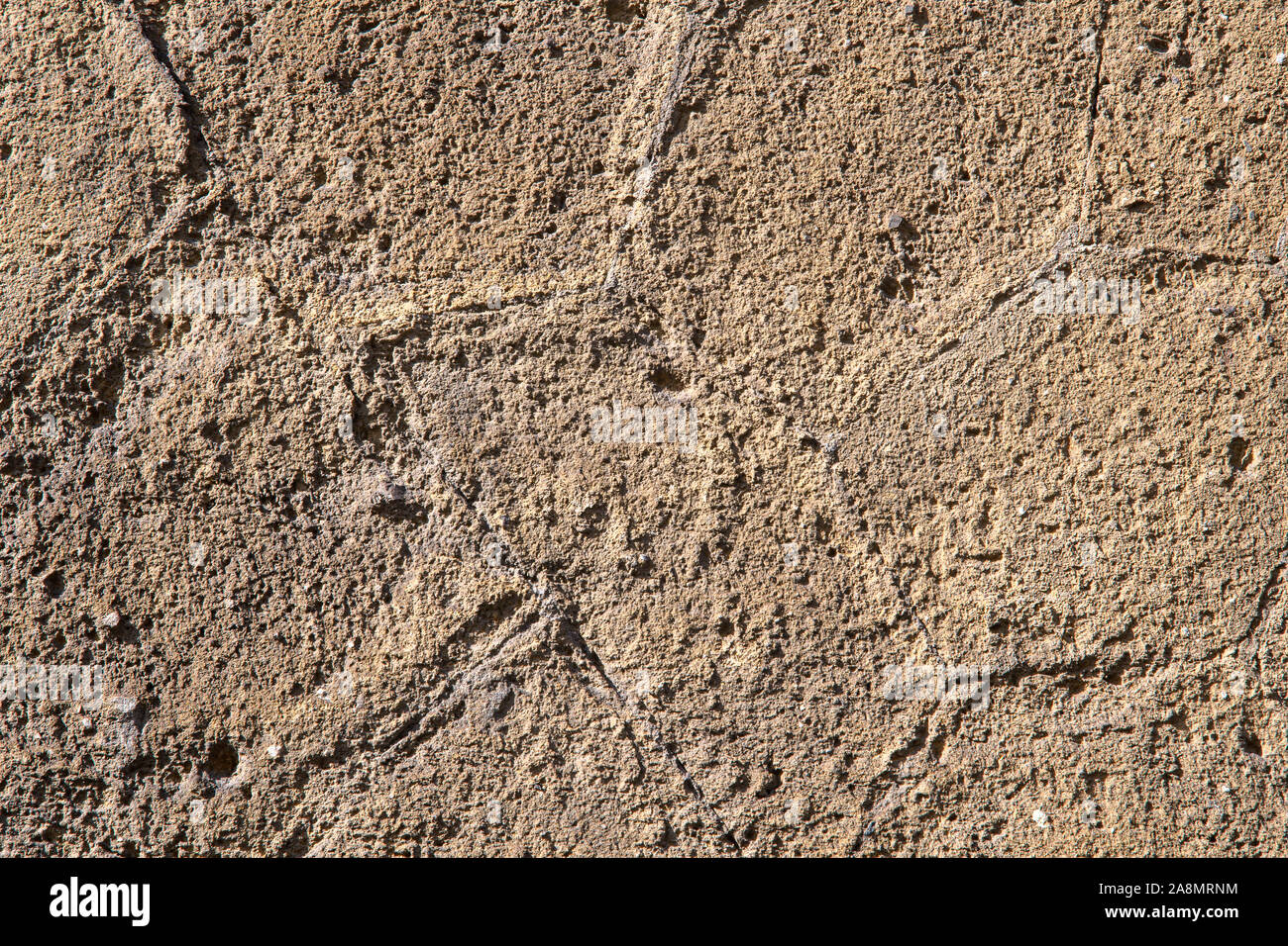Fragment of an old stone wall of an ancient Roman temple made of ...