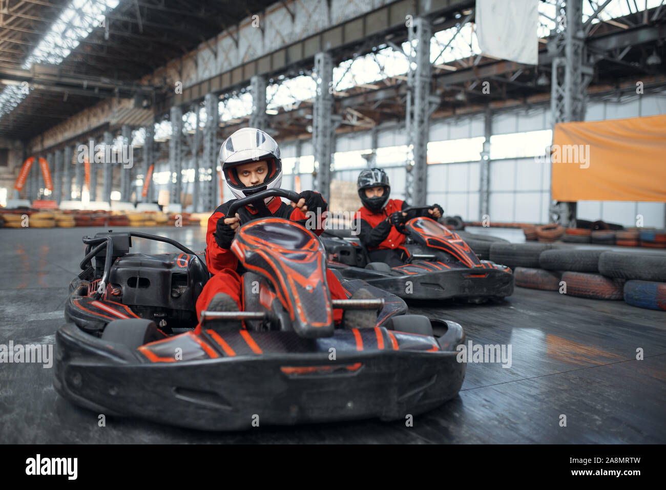 Two kart racers enters the turn, front view Stock Photo - Alamy