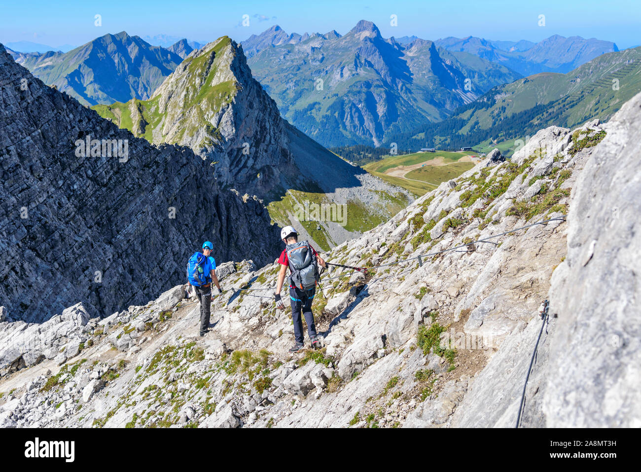 Climbing in via ferrata style in high alpine region in western Austria ...