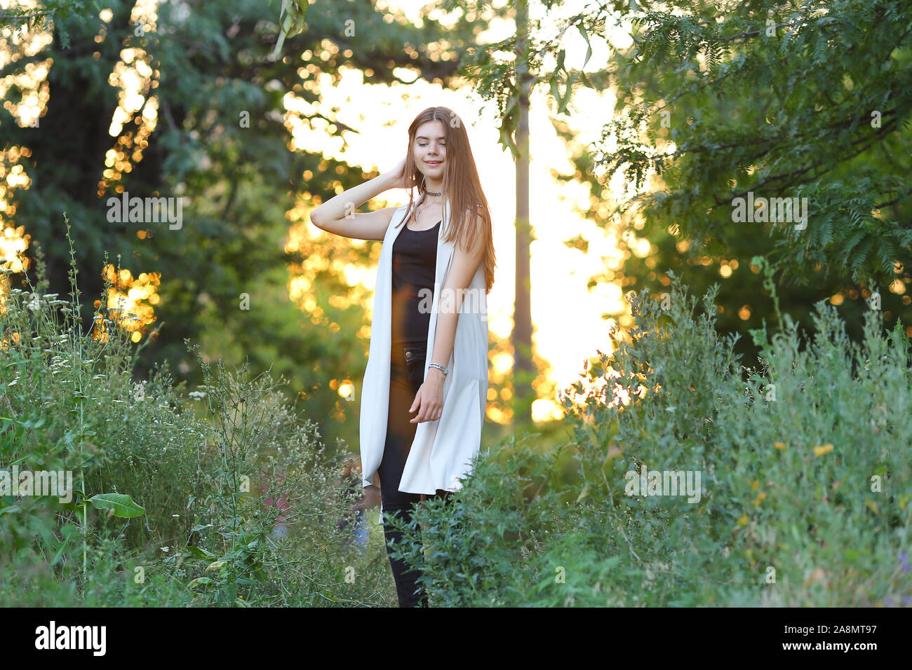 young girl on nature shows emotions Stock Photo - Alamy