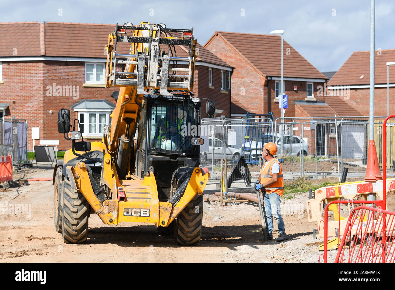 an excavator on a building site Stock Photo - Alamy