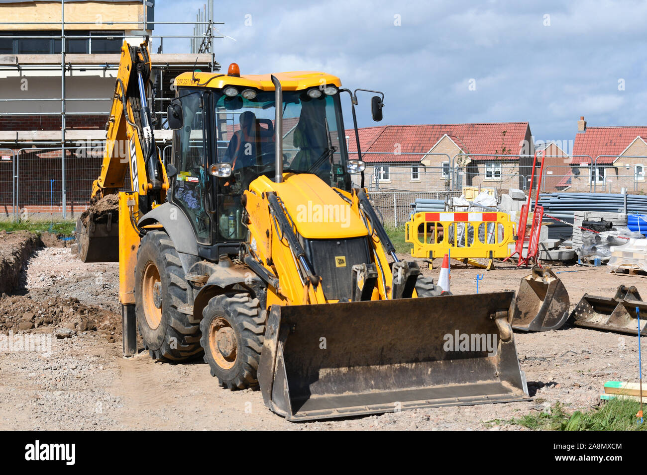 an excavator on a building site Stock Photo - Alamy
