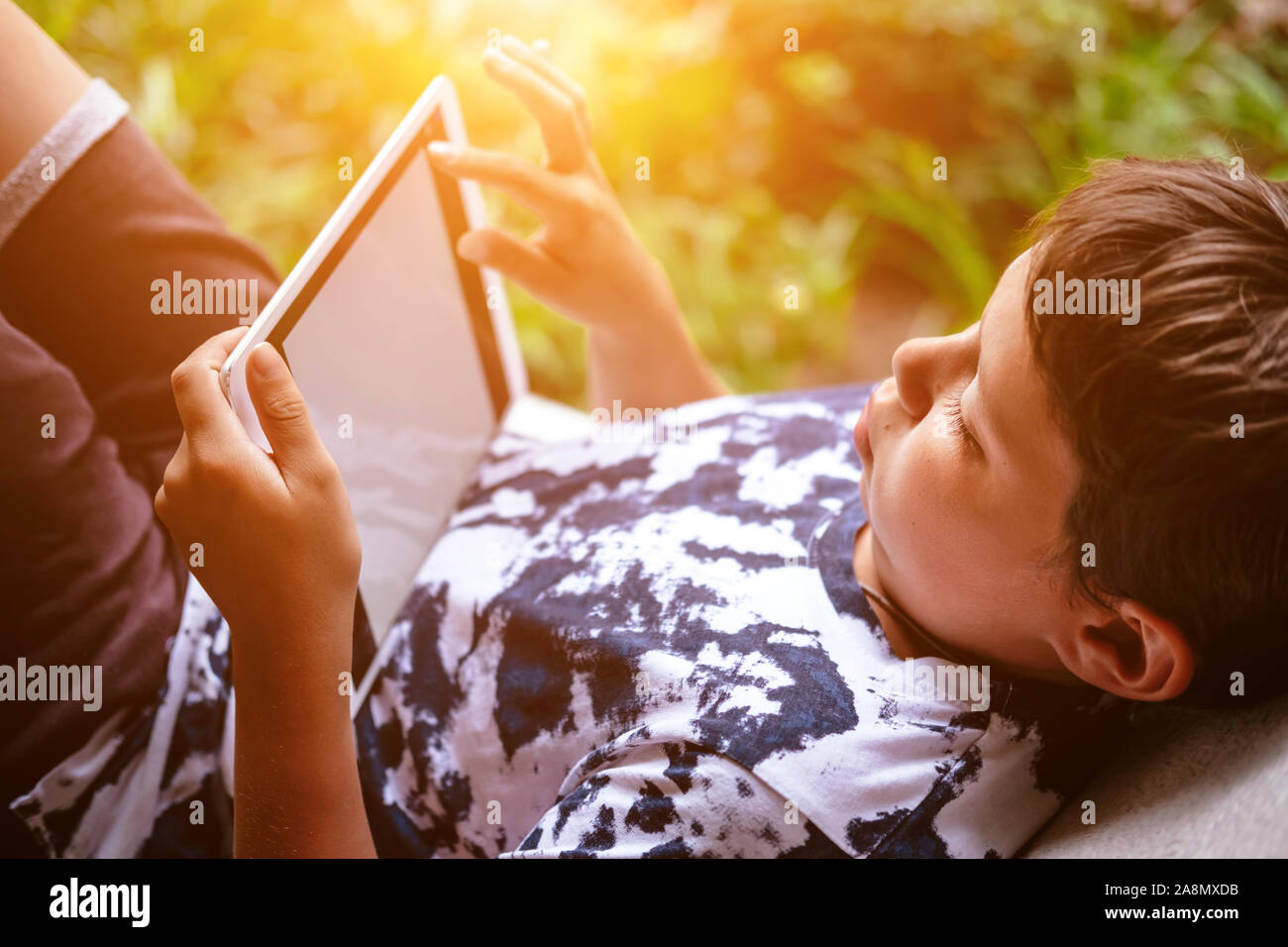 Teenage boy watching computer screen hi-res stock photography and ...