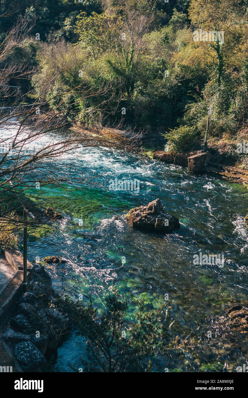 Mountain large source of fresh water fills the river with fast water ...