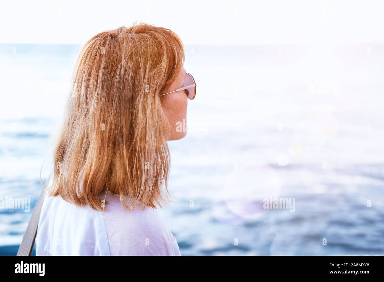 Lady watching ocean hi-res stock photography and images - Alamy