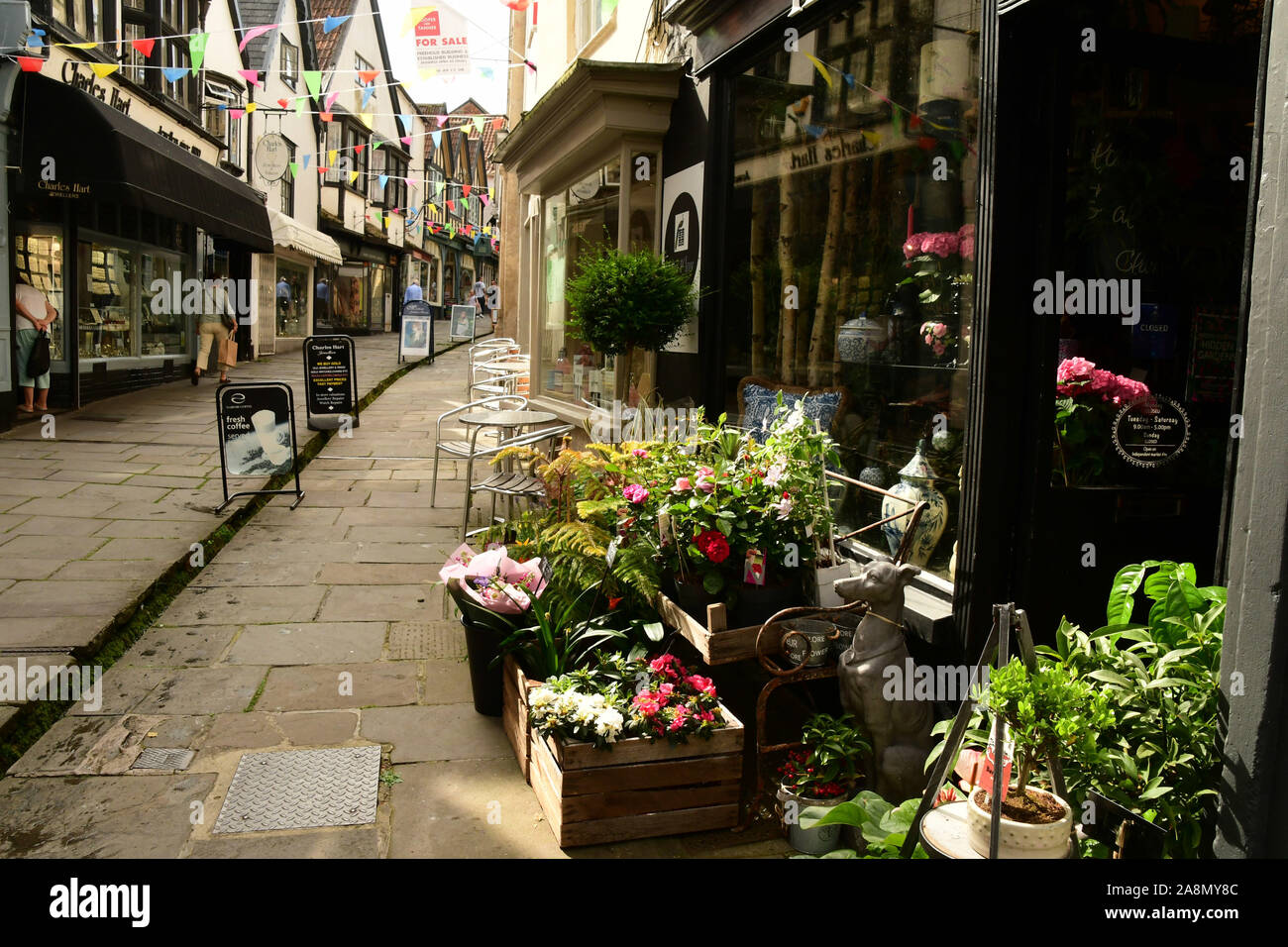 Cheap street in Frome, Somerset. Small independent traders either side ...