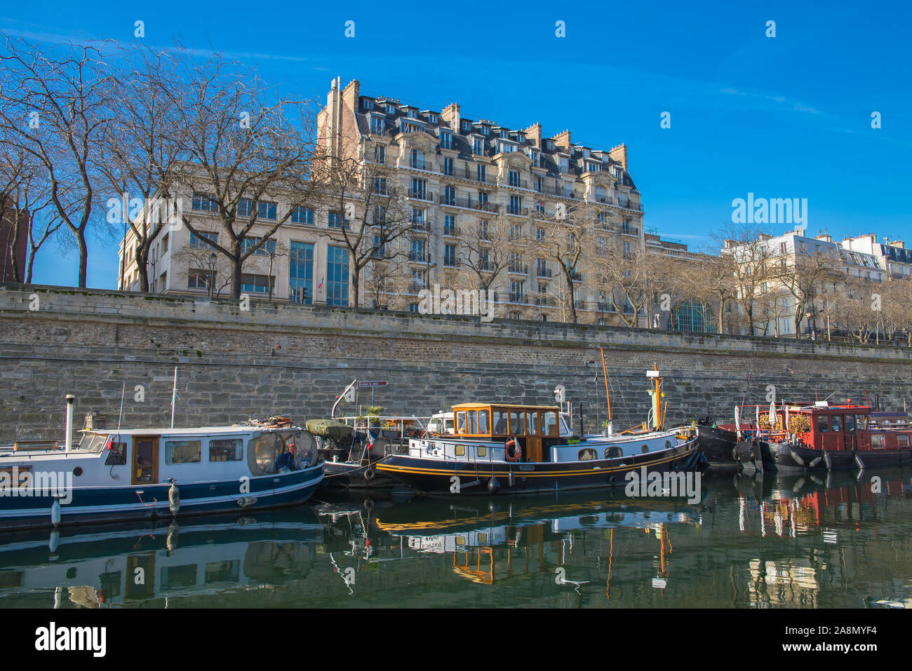Paris, Bastille harbor, houseboats and quay with buildings Stock Photo ...