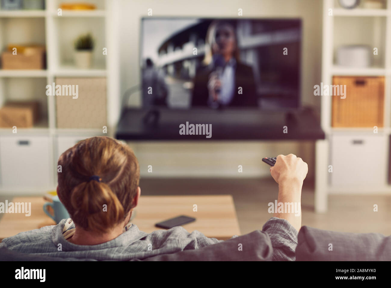 Back view young man switching hi-res stock photography and images - Alamy