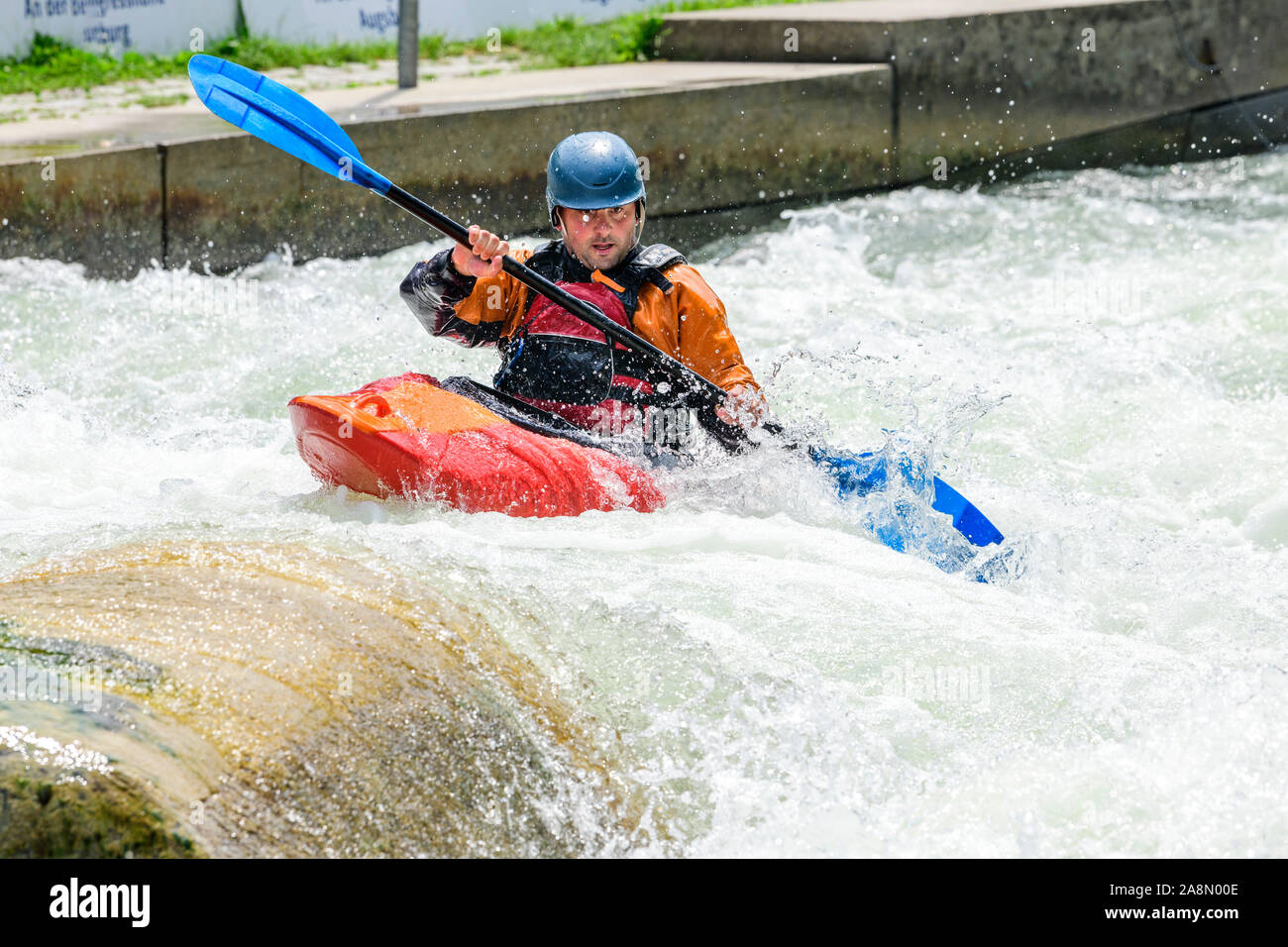 Kayaking on an artificial wild water channel Stock Photo - Alamy