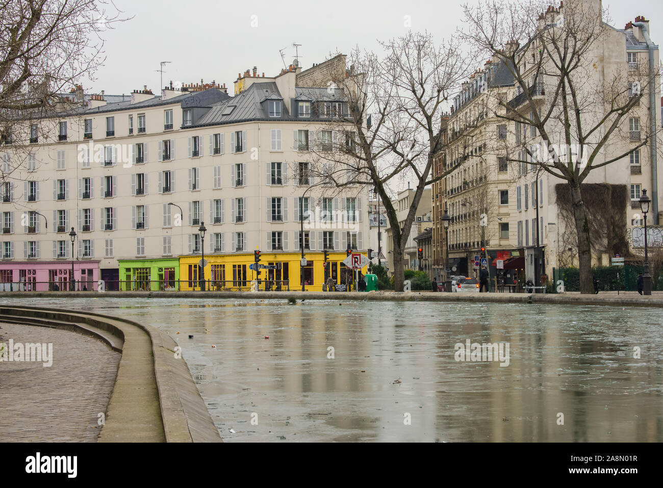Paris, canal Saint-Martin, frozen channel on the quay in winter, with ...