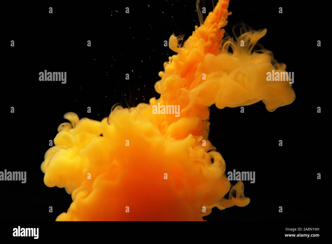 Orange color splash in dynamic hi-res stock photography and images - Alamy