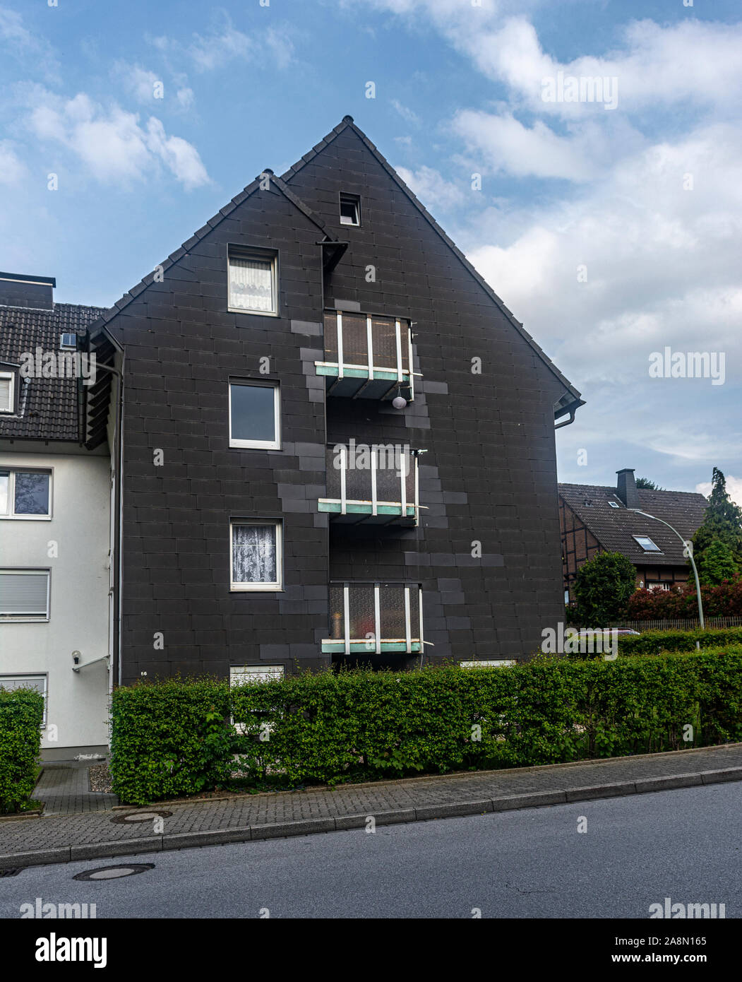 typical European housing. apartment building trimmed with dark material ...