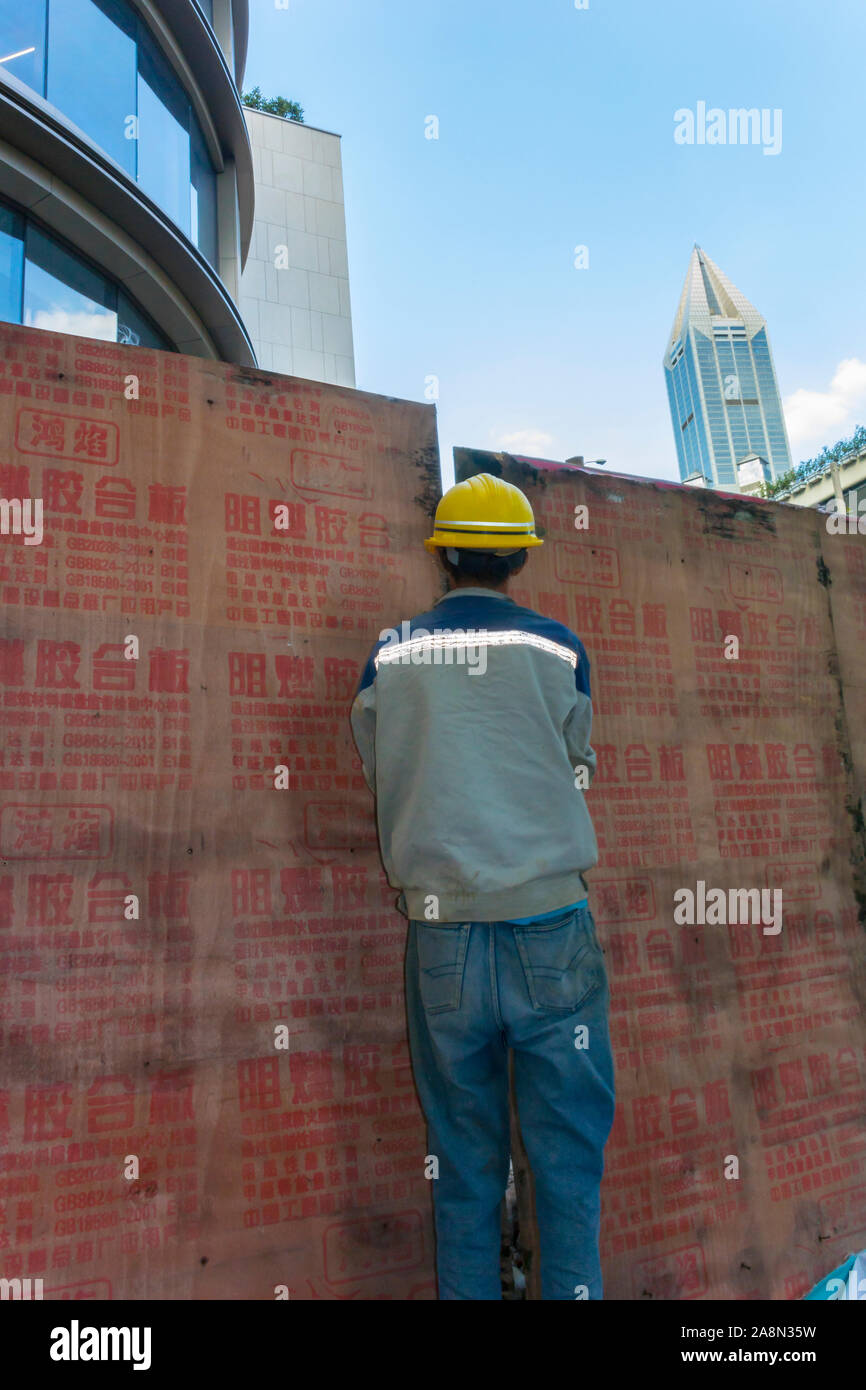 Chinese Construction Workers on Site, Man from Behind Stock Photo - Alamy