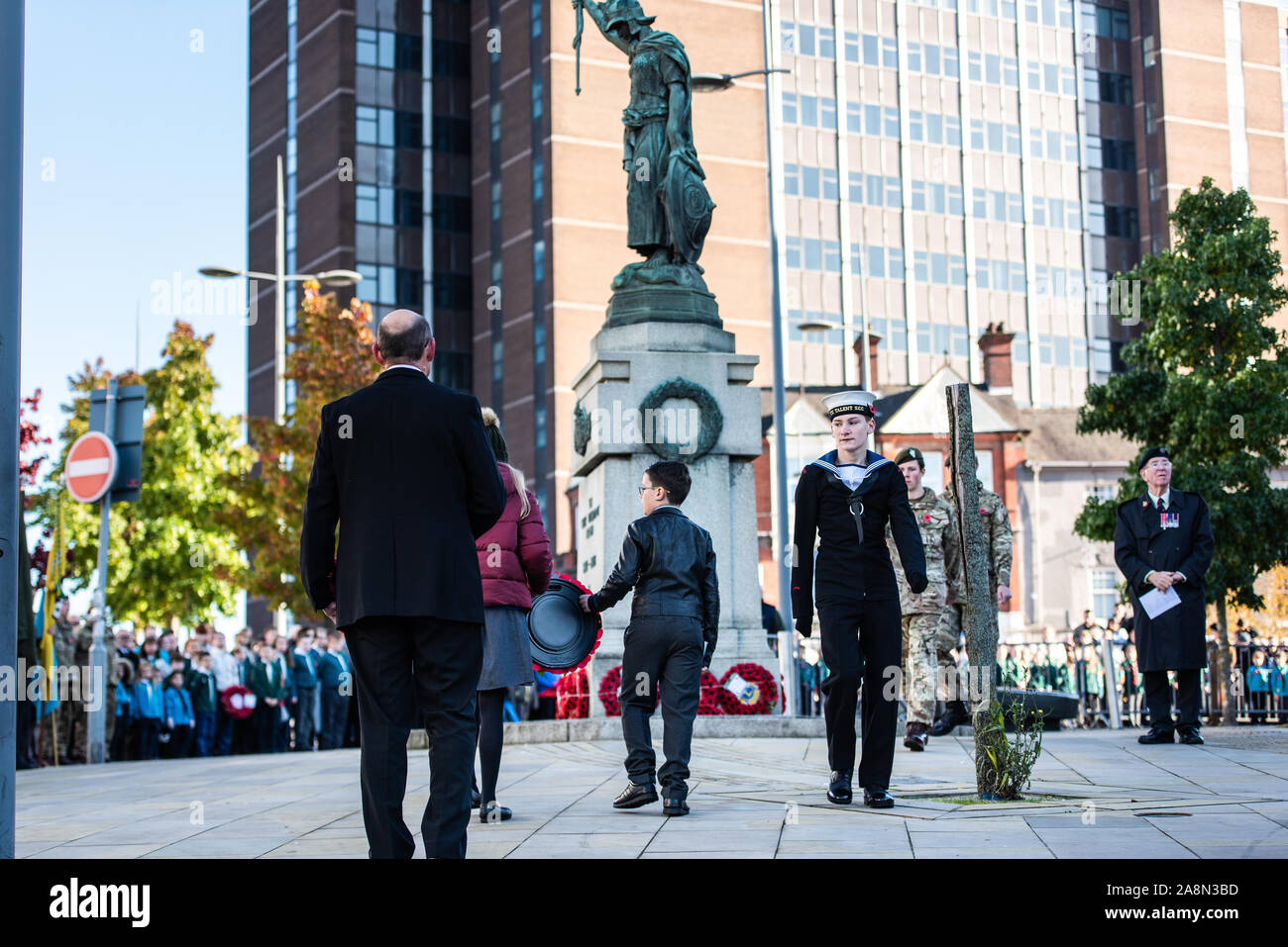 Veterans and civilians lay reefs and notes of condolence to the fallen ...