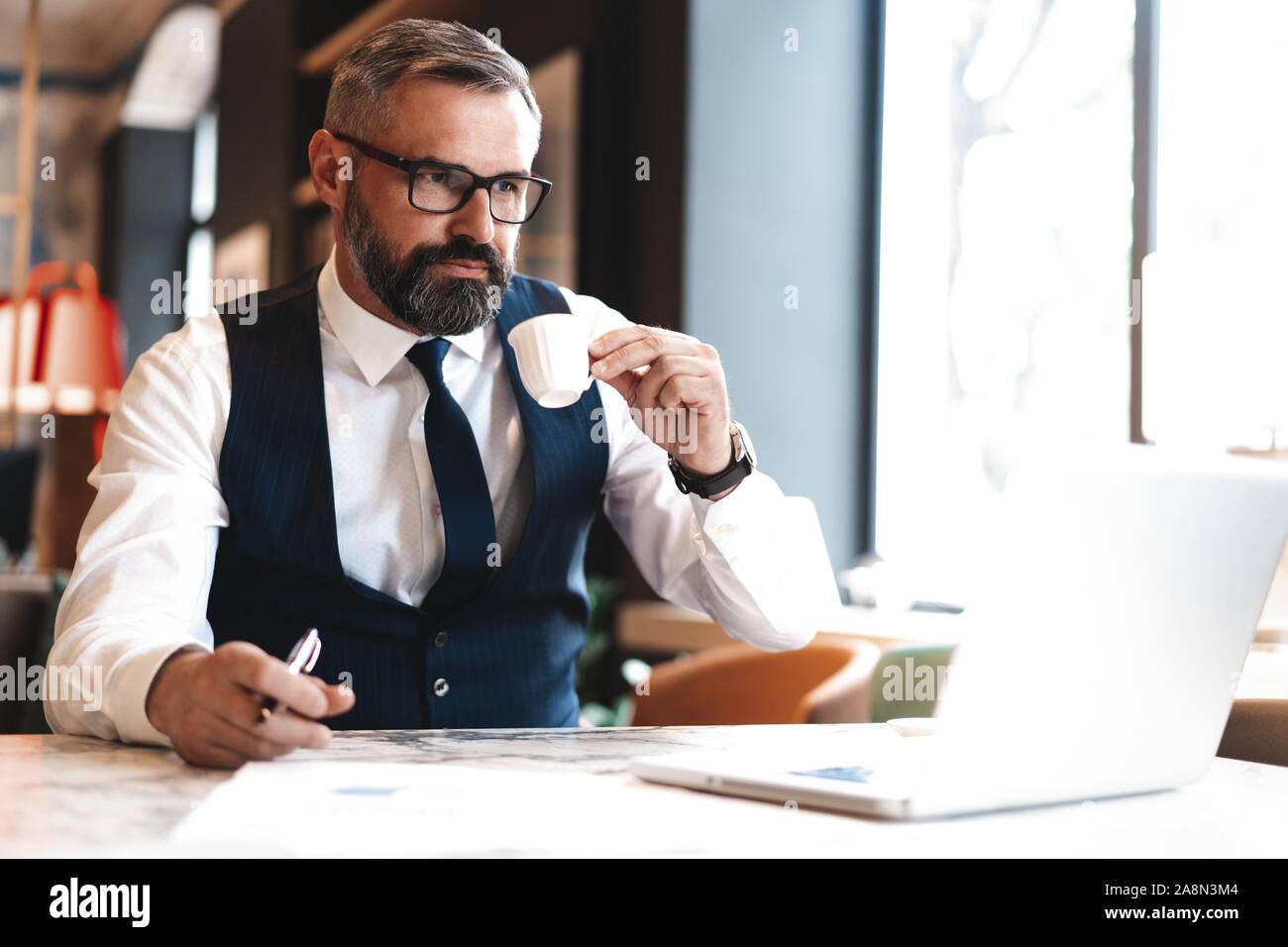 business man working with documents and laptop Stock Photo - Alamy