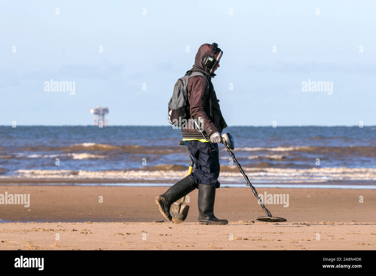 Metal detecting on the beach at Southport, UK. 10th November 2019 ...