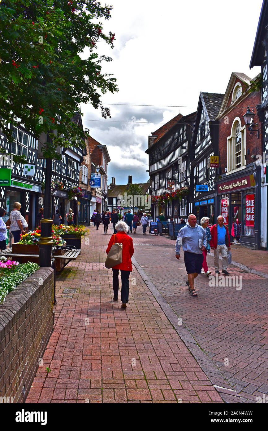 A view of the ancient half-timbered buildings in the High Street of ...