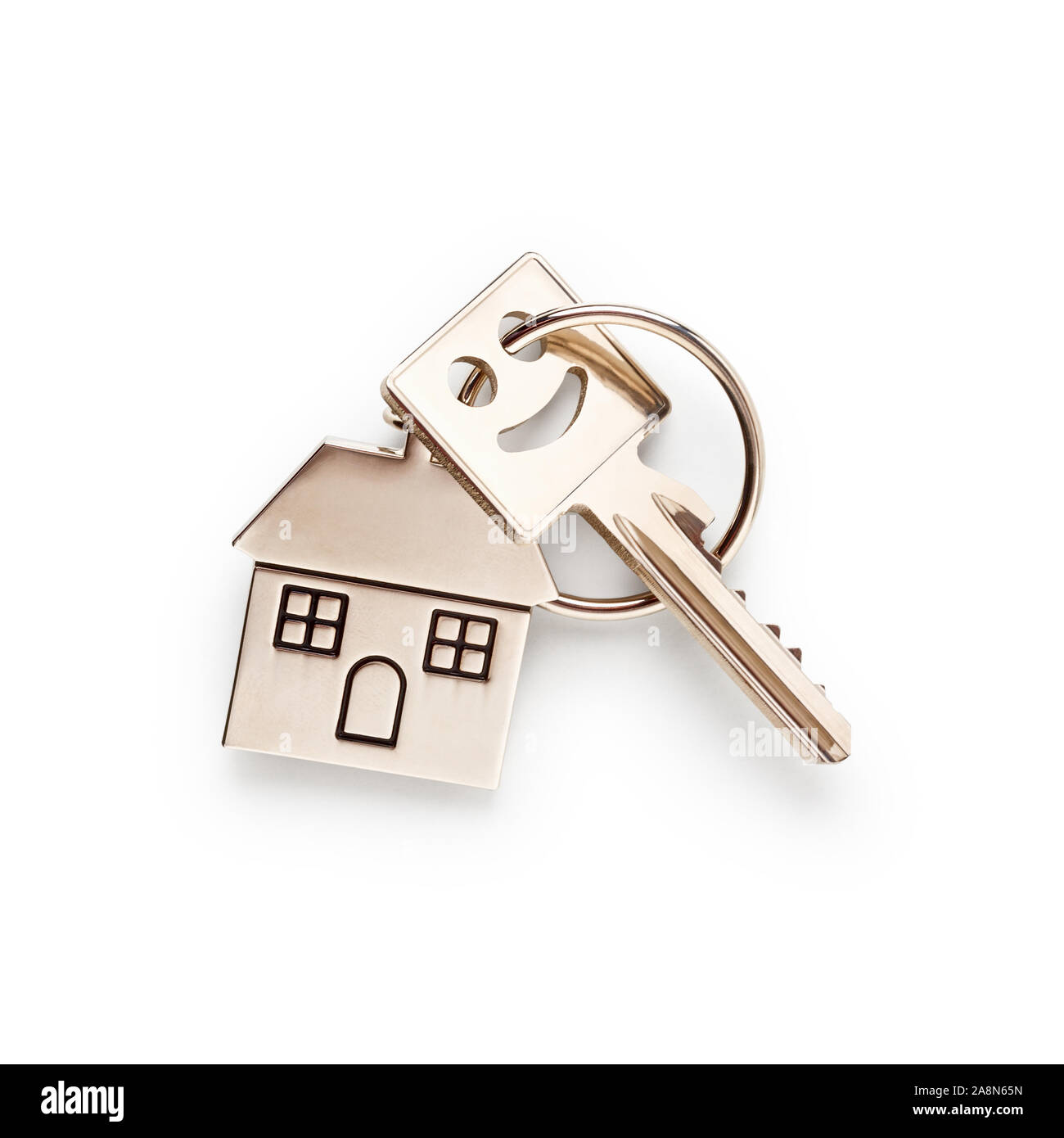 Key and house shaped keychain arrangement isolated on white background ...