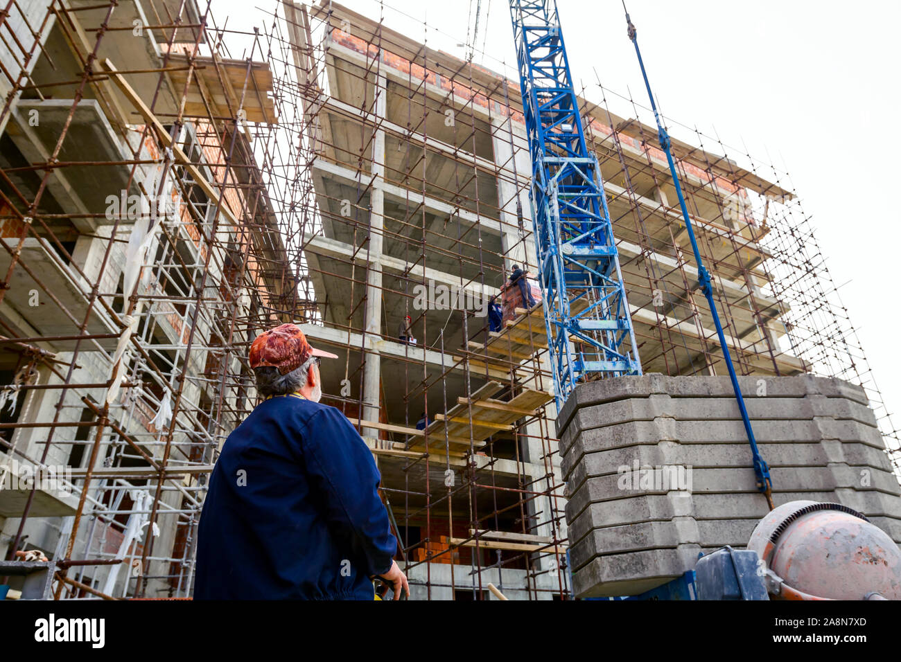 Operator, worker is holding industrial remote, wireless, console to ...