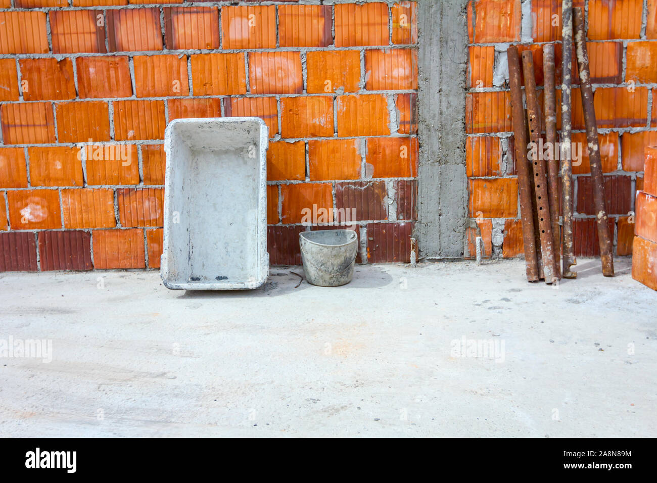 Set of different tools, equipment for brickwork with red blocks and ...