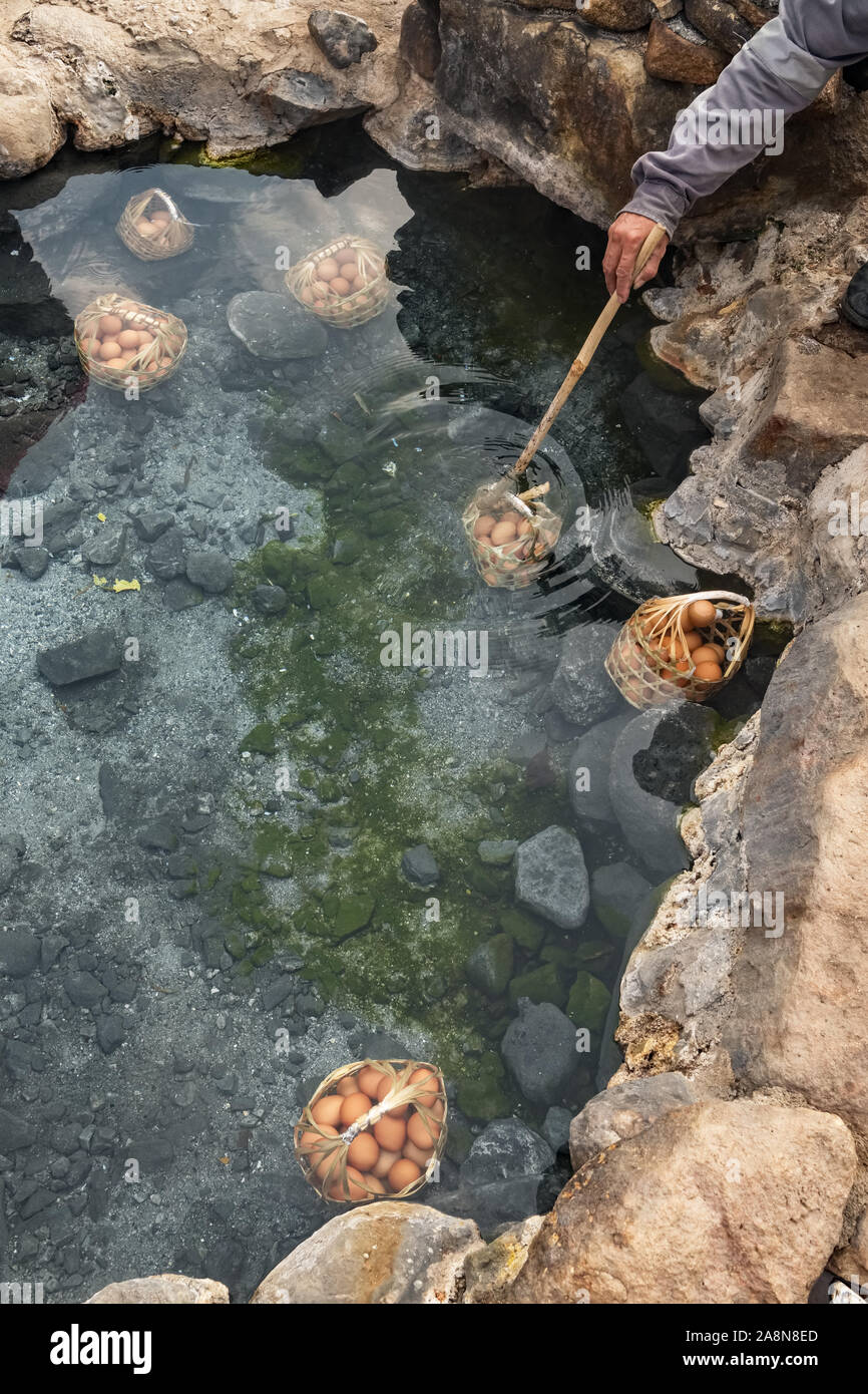 Cooking eggs in natural hot spring in Chae Son National Park, Thailand ...