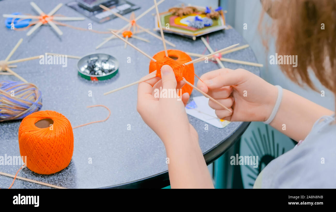 Teenager hands making handmade mandala Stock Photo - Alamy
