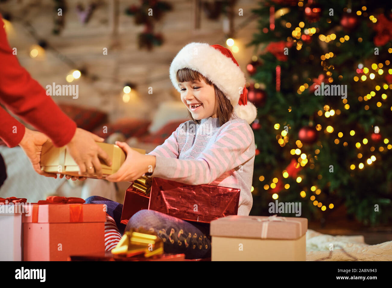 Child receiving gift hi-res stock photography and images - Alamy