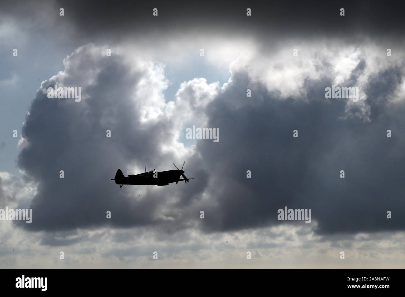 World War II Spitfire flies over Kent, during a formation to drop of ...