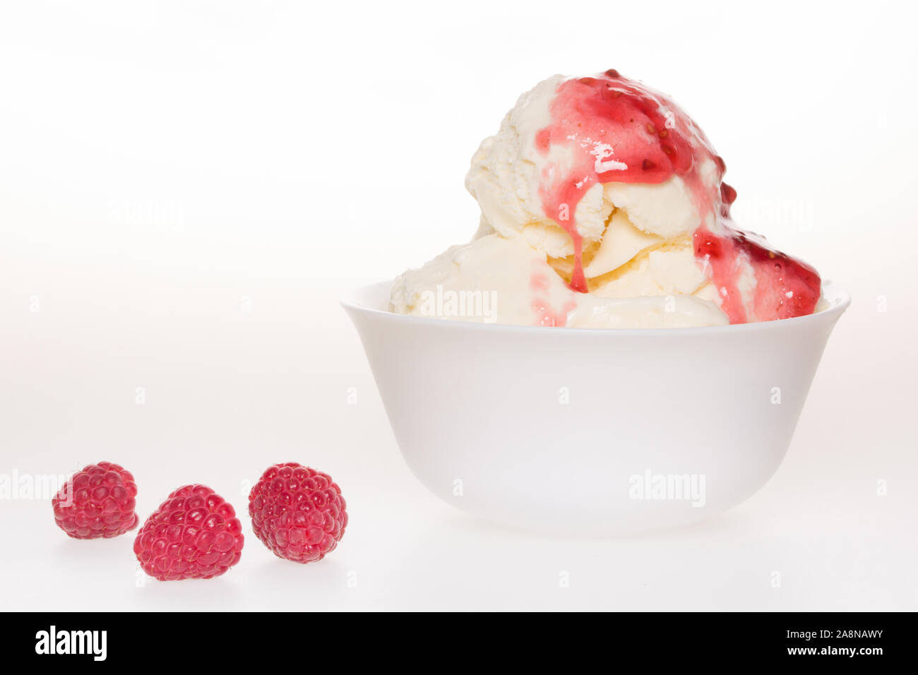 Vanilla ice cream and juicy ripe raspberries Stock Photo - Alamy