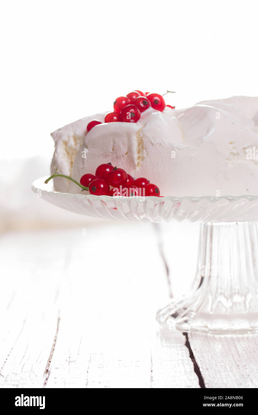 Vanilla ice cream with red currant on white background Stock Photo - Alamy