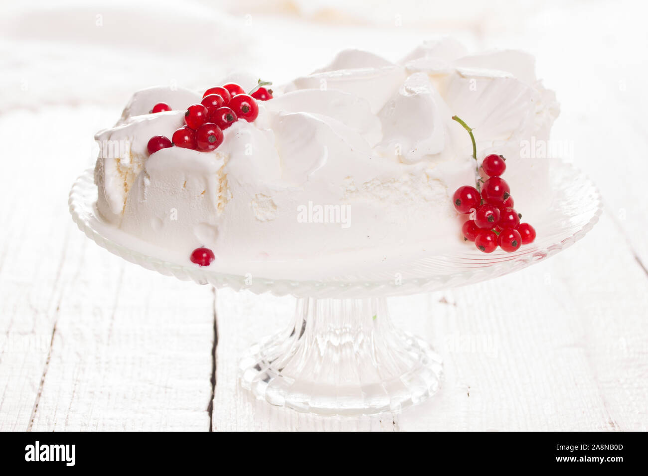 Vanilla ice cream with red currant on white background Stock Photo - Alamy