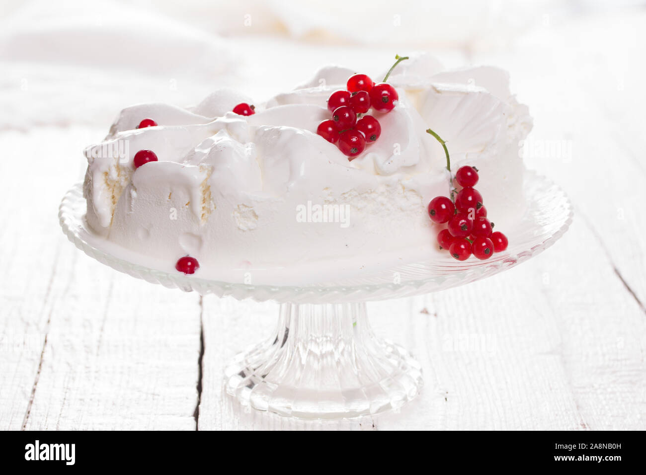 Vanilla ice cream with red currant on white background Stock Photo - Alamy