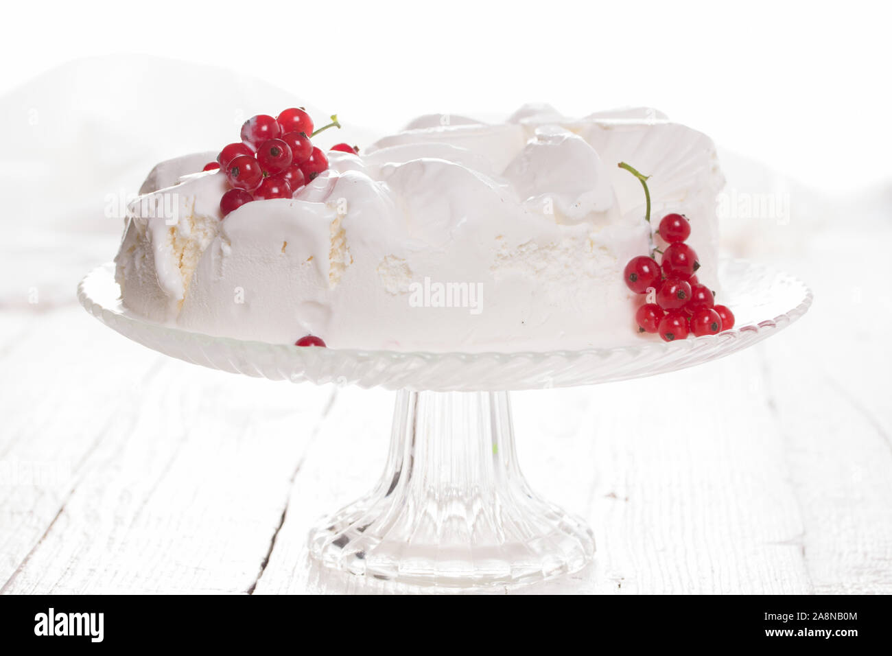 Vanilla ice cream with red currant on white background Stock Photo - Alamy