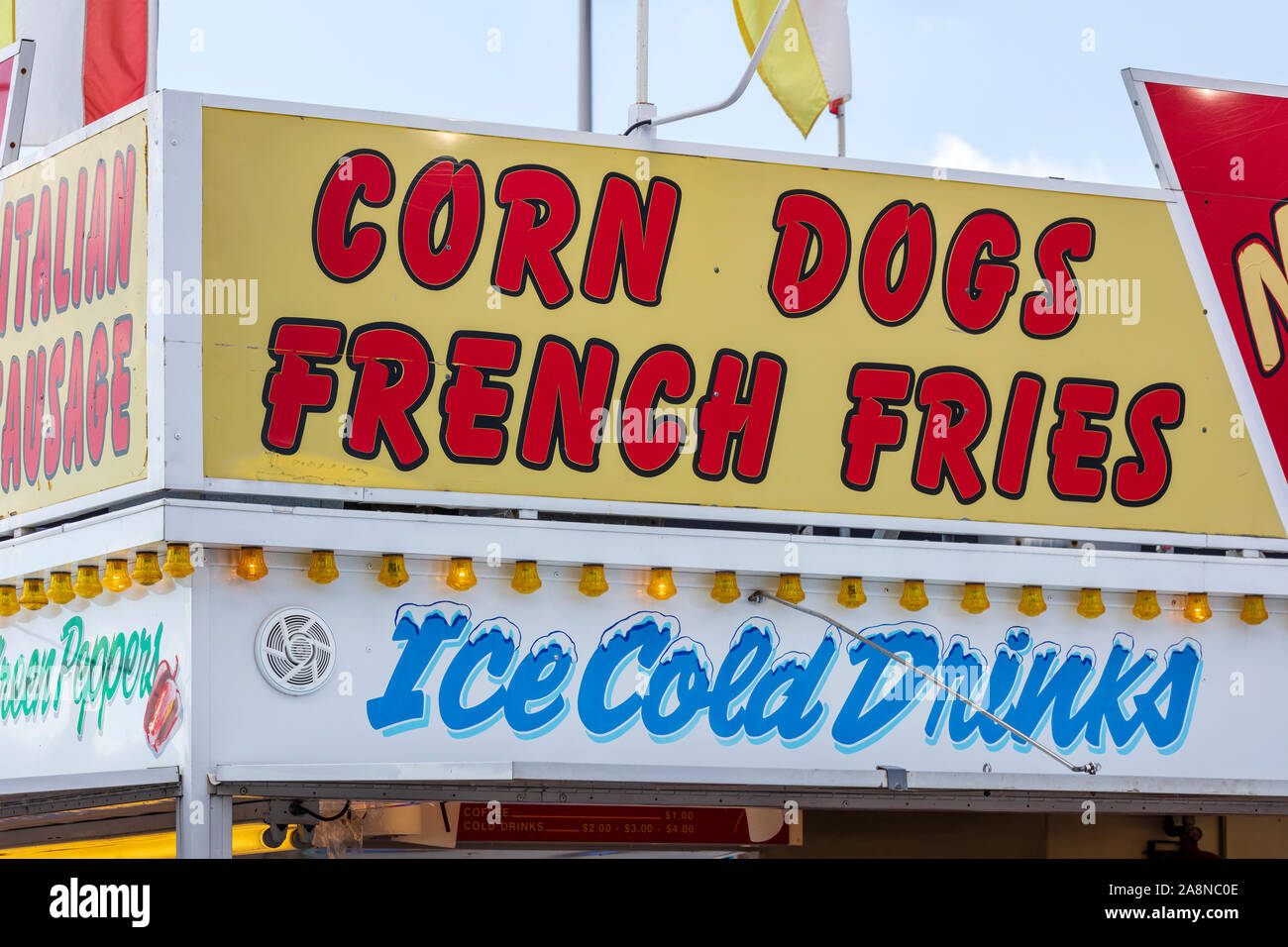 Corn dogs and french fries, fast food signs at carnival, United States ...