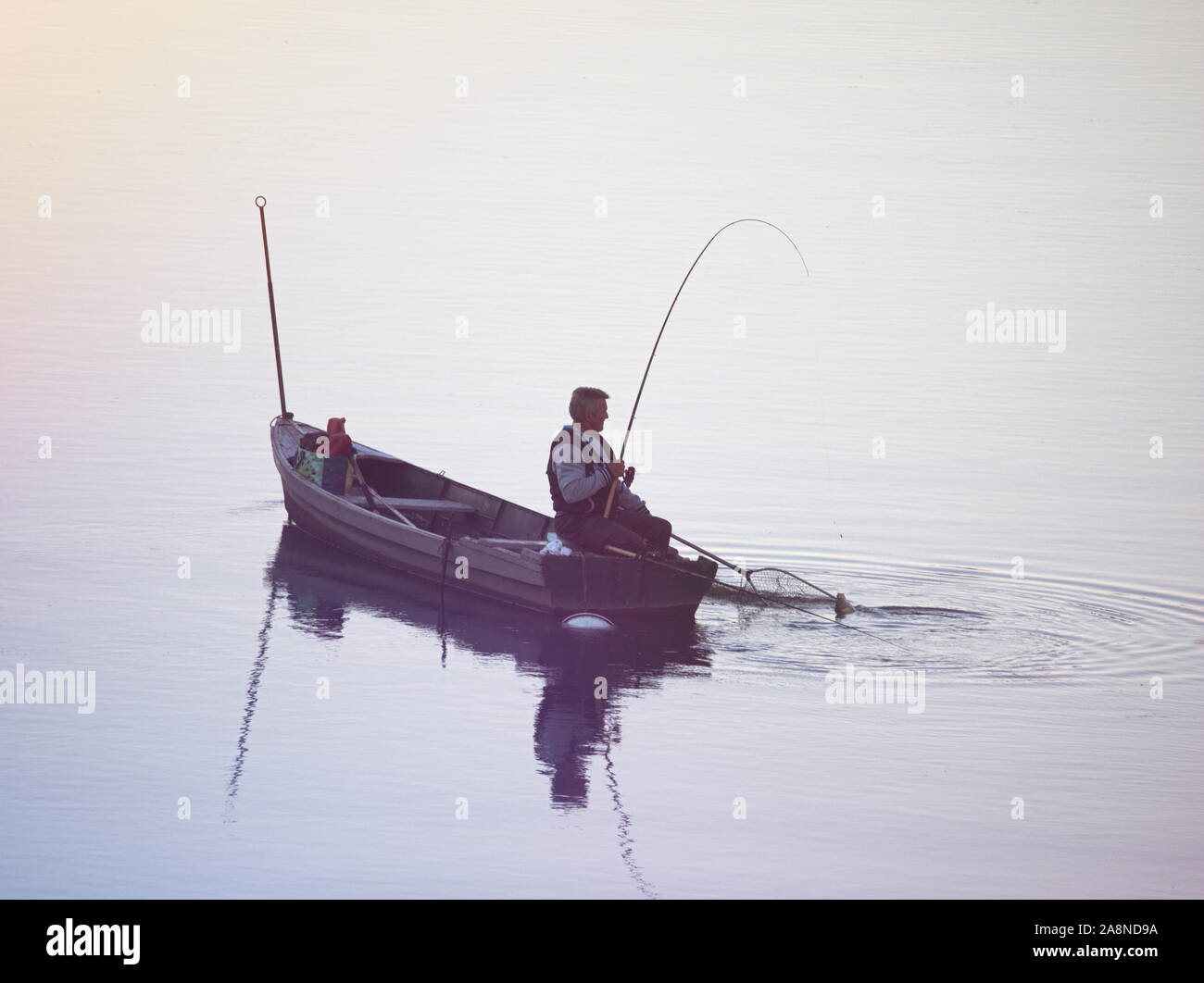 Pulling in the catch hi-res stock photography and images - Alamy