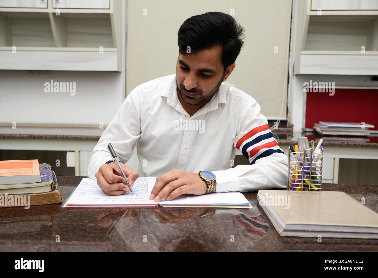 Indian student writing exam hi-res stock photography and images - Alamy