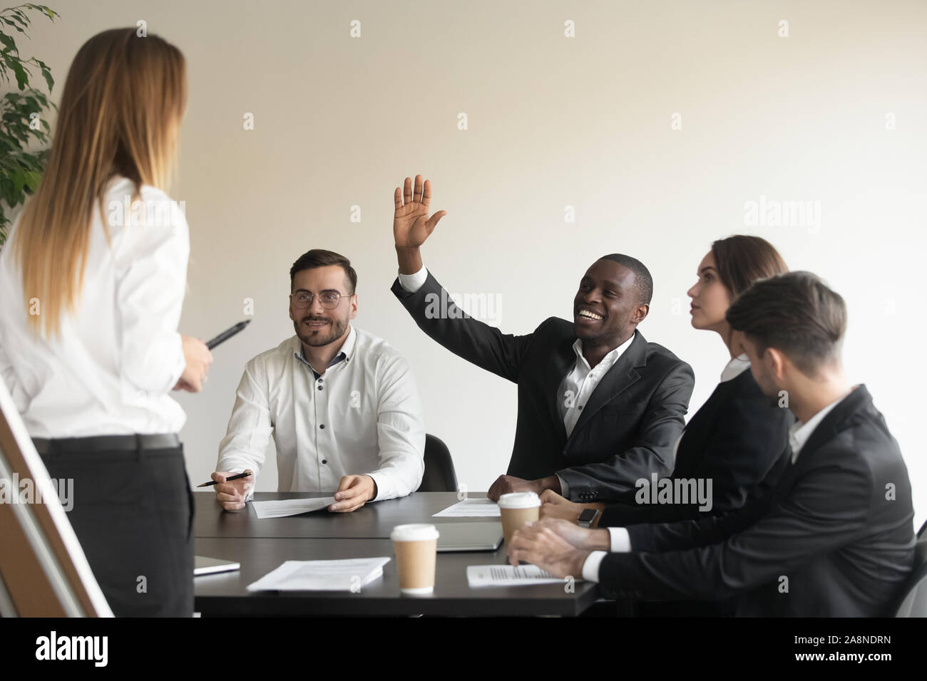 Woman raise hand want to speak hi-res stock photography and images - Alamy