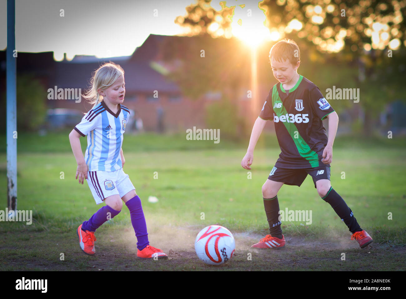 Argentina children playing football in hi-res stock photography and ...