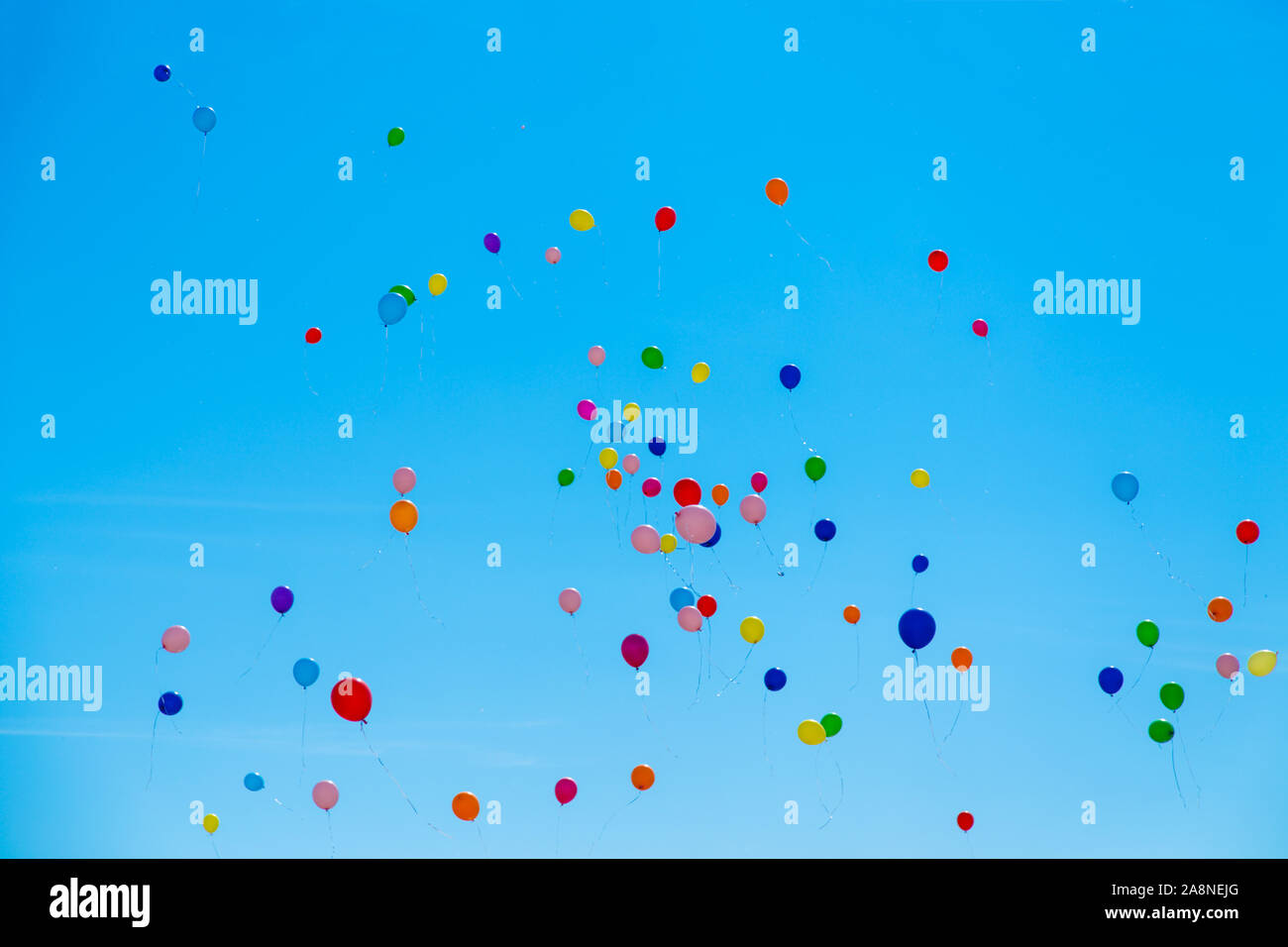 Many colorful balloons flying in the sky Stock Photo - Alamy