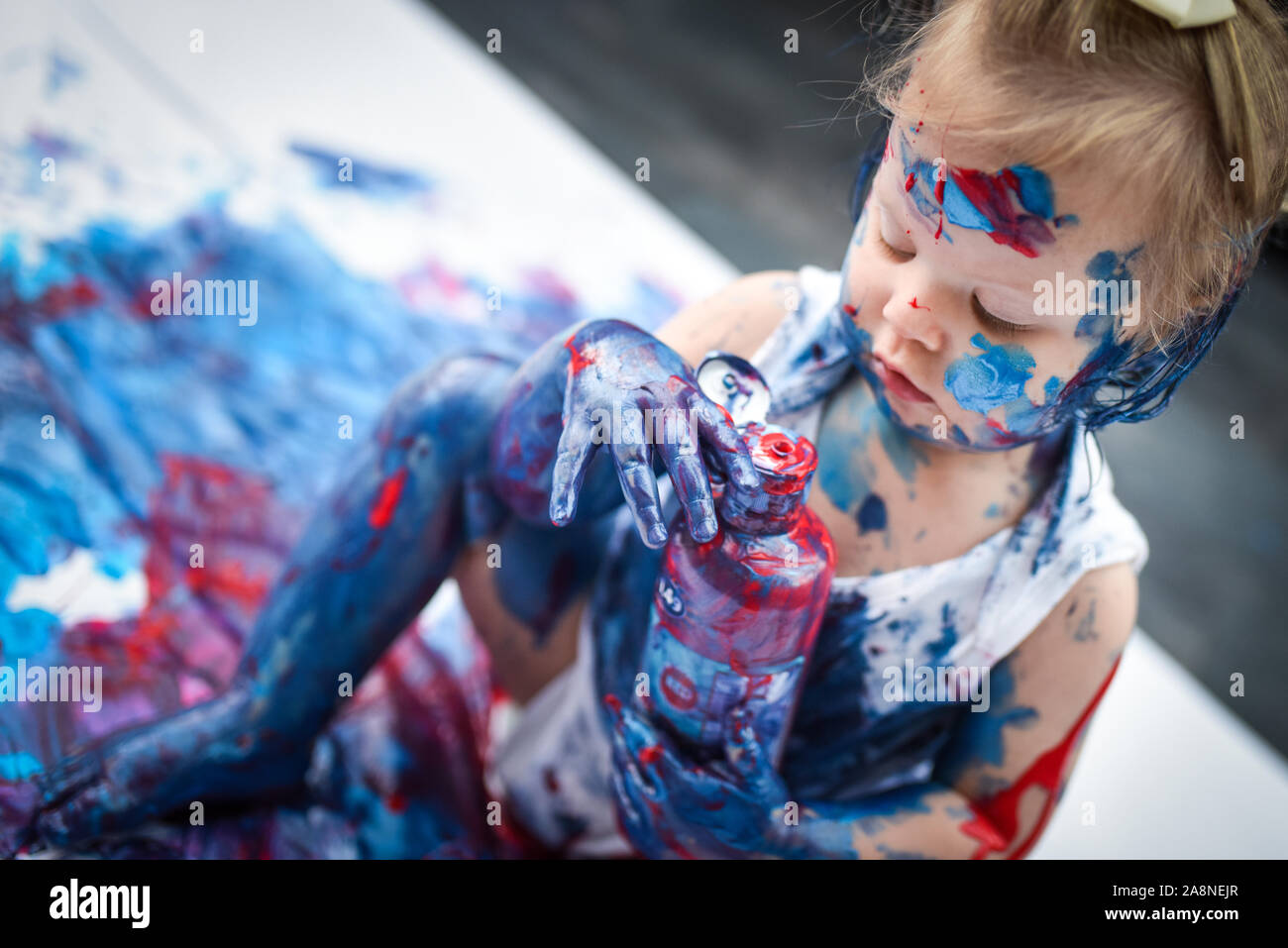 School girl colouring in picture hi-res stock photography and images ...