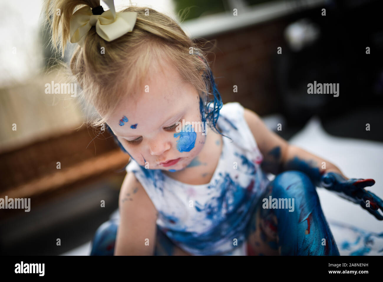 School girl colouring in picture hi-res stock photography and images ...