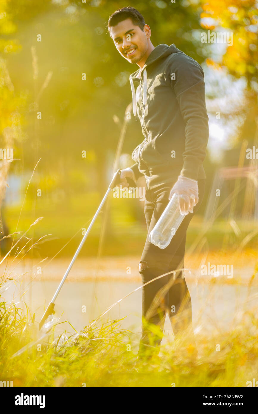 Volunteer conserving environment from pollution and plastic Stock Photo ...