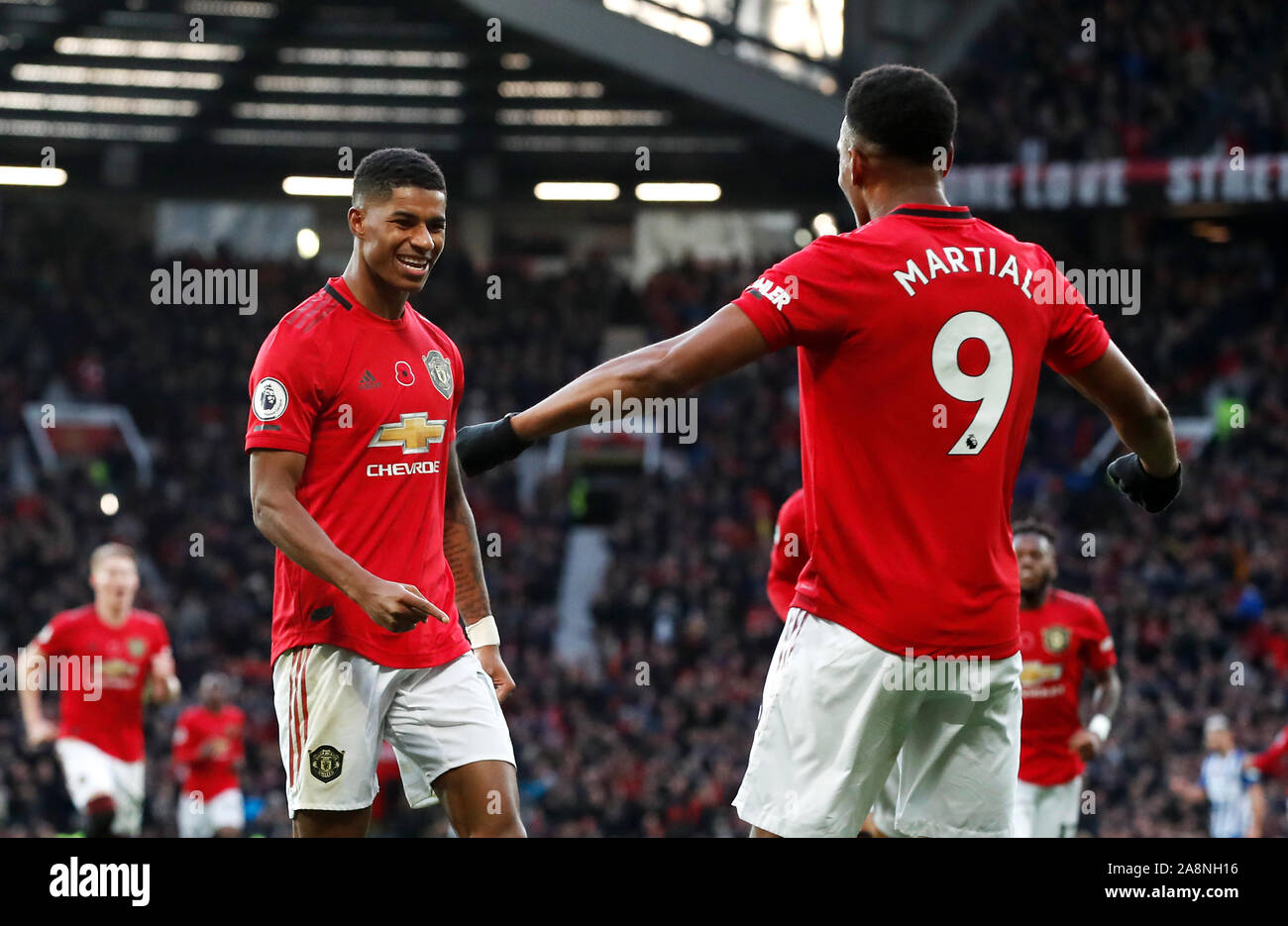Manchester United's Marcus Rashford (left) celebrates scoring his side ...